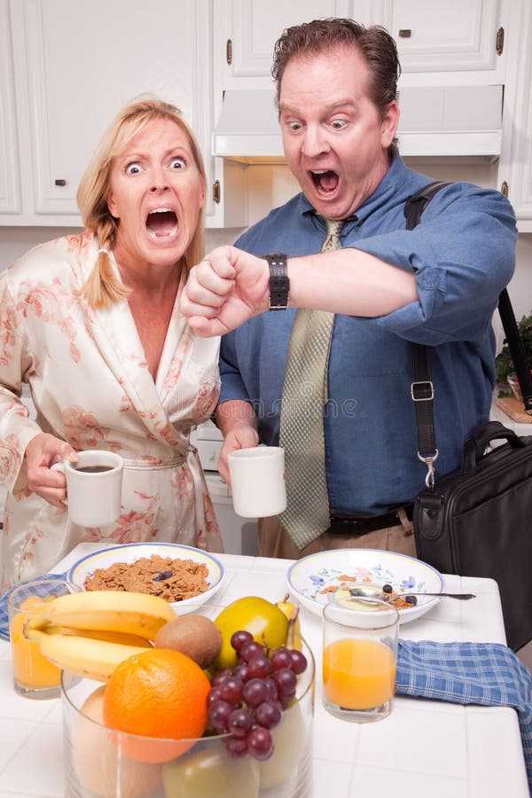 Couple Stressed Out in Kitchen Late for Work Stock Photo - Image of ...