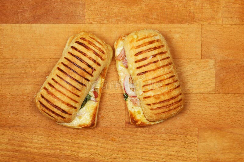 Panini on a board stock image. Image of bread, basil - 158099097