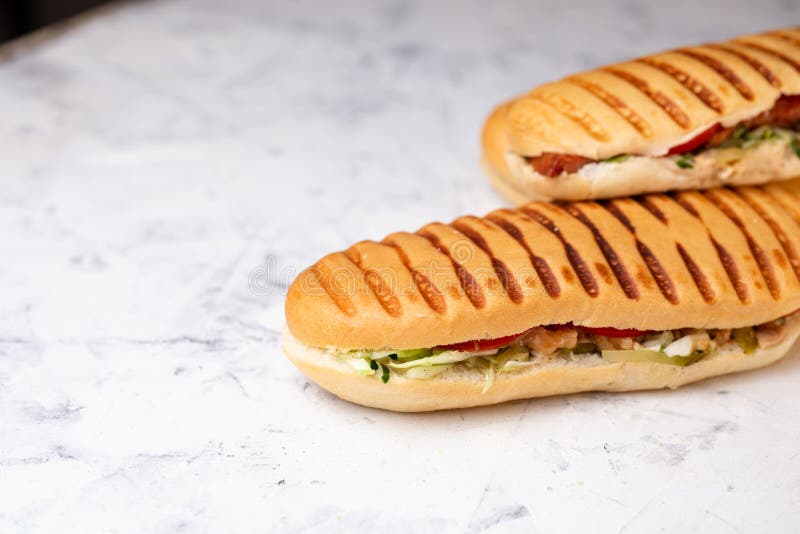 Panini Con Relleno. Tres Paninis De Fondo Blanco Imagen de archivo ...