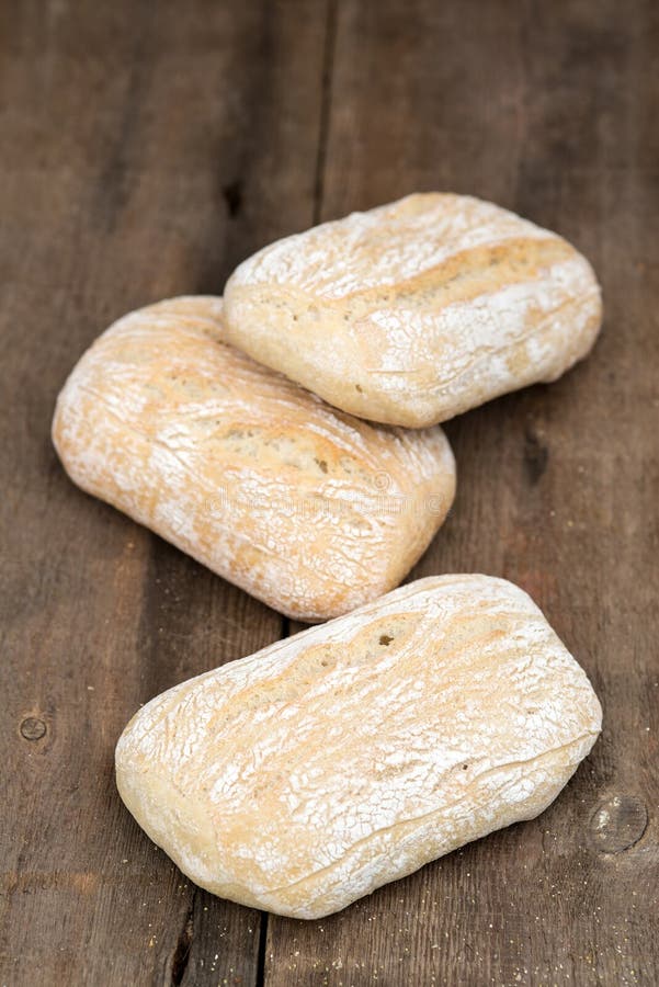 Panini Rolls in Rustic Kitchen Setting with Cooking Utensils Stock ...