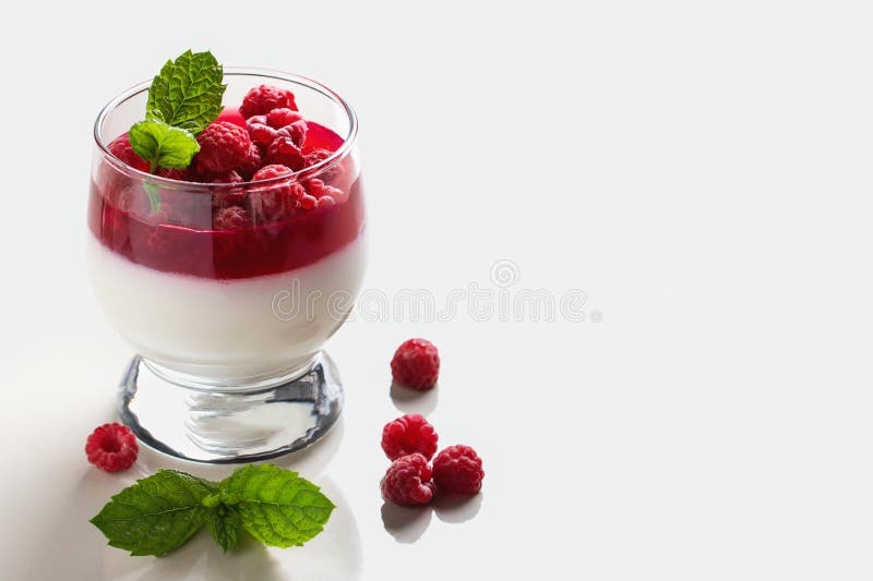 Panna Cotta with Raspberry Jelly and Mint Leaves in Glass Glasses on a ...