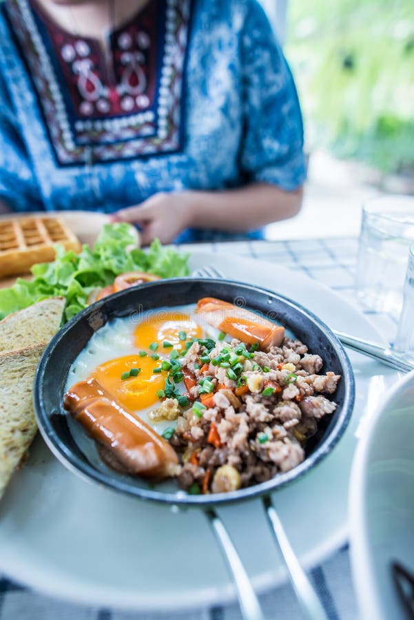 Panned egg on a white dish stock photo. Image of gourmet - 263303562