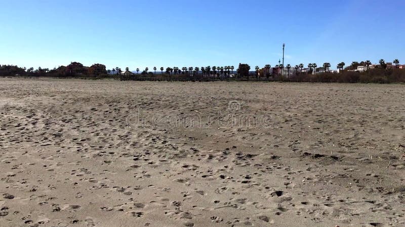 An almost Empty Beach at Sunset with Soft Waves Breaking Up a ...