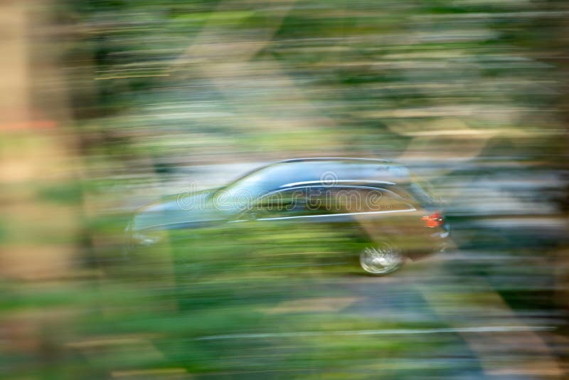 Panning Shot of a Car Photographed through Trees Stock Image - Image of ...