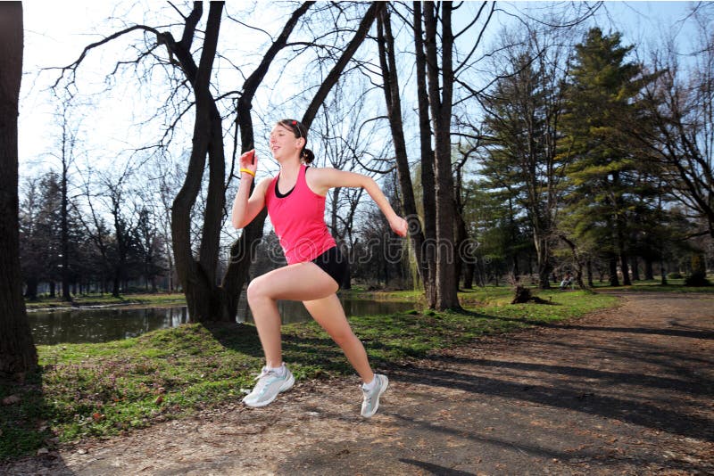 Panning Shot of a Female Runner Running Stock Photo - Image of lope ...