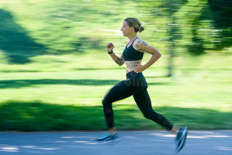A Panning Shot of Female Runner Stock Photo - Image of running, runner ...
