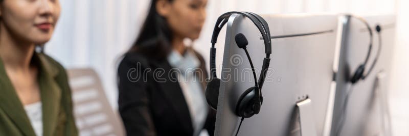 Panorama Focus Headset on Call Center Workspace Desk with Blur Operator ...