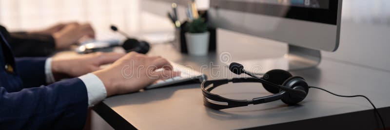 Panorama Focus Headset on Call Center Workspace Desk with Blur Operator ...