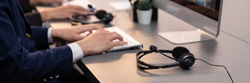 Panorama Focus Headset on Call Center Workspace Desk with Blur Operator ...