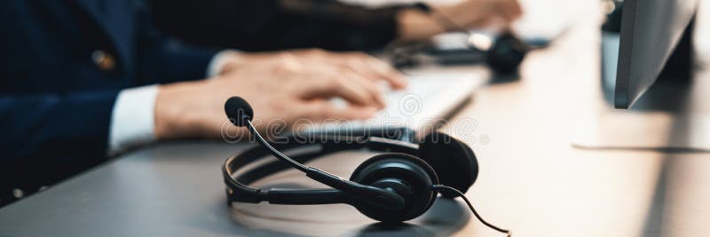 Panorama Focus Headset on Call Center Workspace Desk with Blur Operator ...