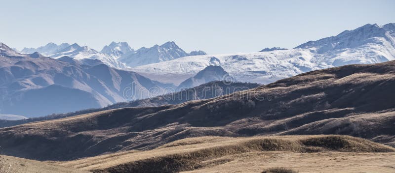 Panorama of a Mountain Range from Layers of Rocks with the First Snow ...