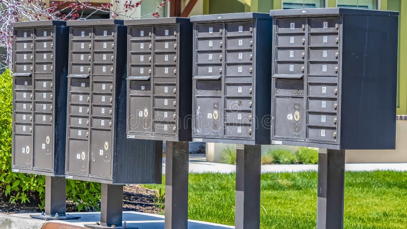 Panorama Row of Cluster Mailboxes with Numbered Compartments on a ...