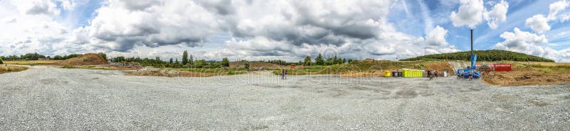 Panorama Shot of a Landscape with a Construction Site in the Forefront ...