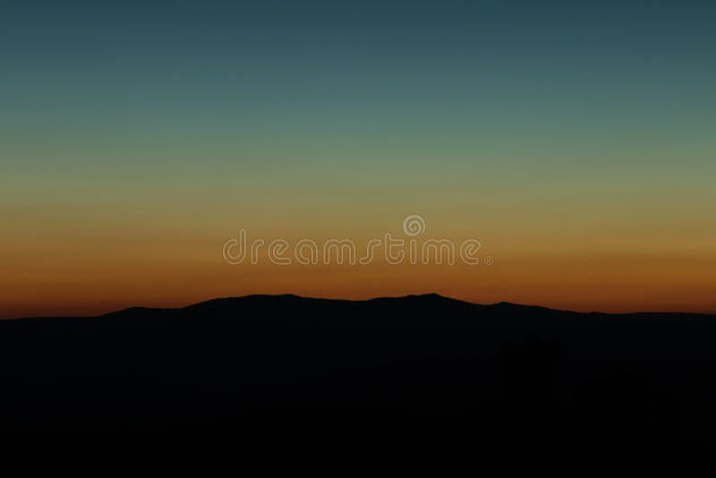 Panorama Silhouette Mountain Tops in Orange Blue Gradient Sunset Stock ...