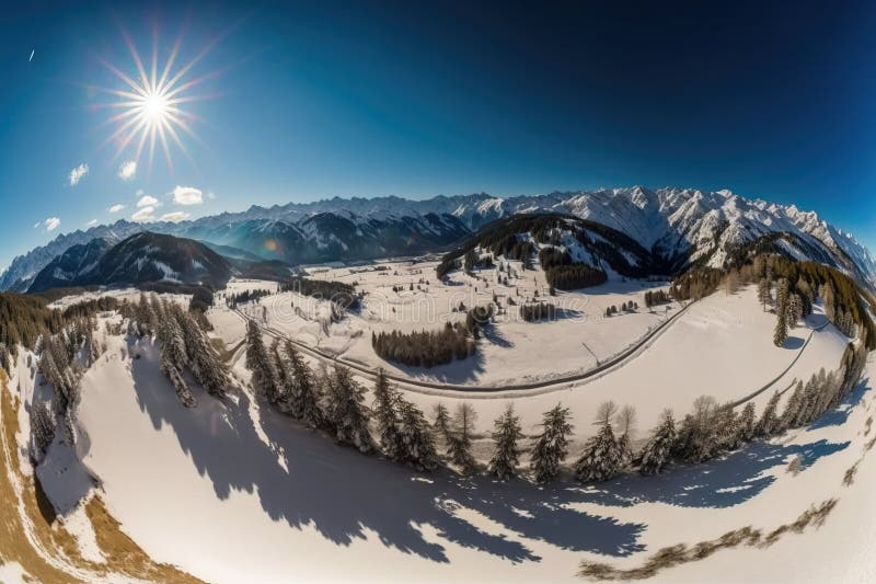 A Panorama of a Snow Covered Mountain with a Bright Sun Stock ...