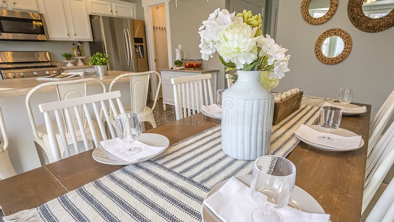 Panorama Table Setting Inside a Dining Room with Brown Table and White ...