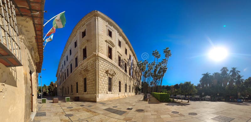 Panorama of Typical Pedestrian Street in Malaga, with Waving Flags of ... Panorama of Typical Pedestrian Street in Malaga, with Waving Flags of ...