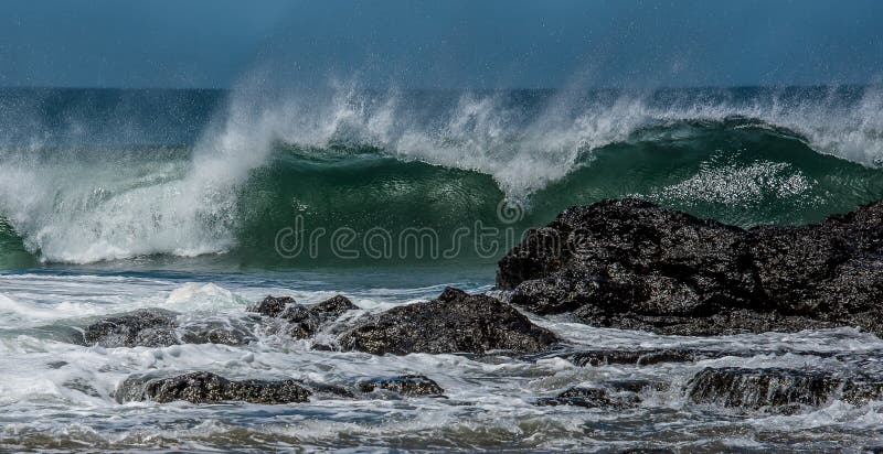 Panorama Wave Cresting Behind Rock in Hawaii Stock Image - Image of ...