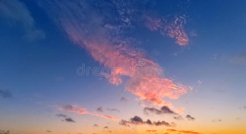 Panorama of the Yellow Sky with Fancy Clouds at Sunset Stock Photo ...