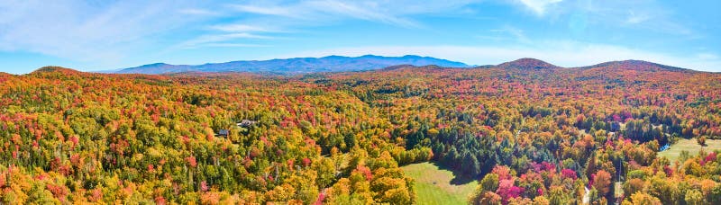 Panoramic Aerial Over Peak Fall Forest Mountains in Vermont with Blue ...