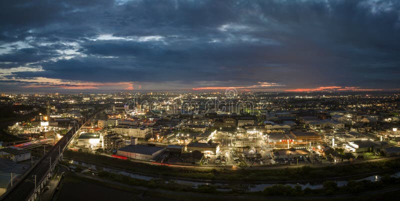 Panoramic Aerial View of Elevated Train Tracks and City Lights after ...
