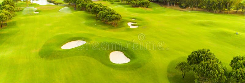 A Panoramic Aerial View of a Golf Course with Sand Traps and Vibrant ...