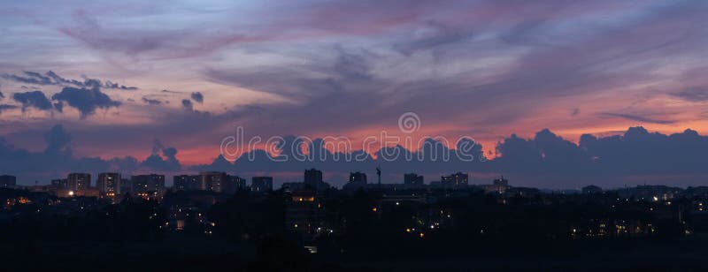 Panoramic Cityscape with Clouds in the Sunset Sky Repeating the ...