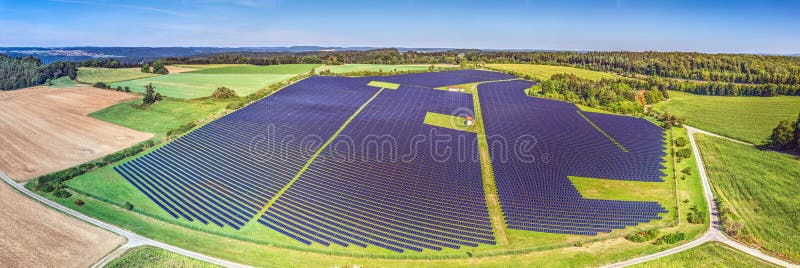 Panoramic Image of a Large Solar Field on a Green Meadow in Daylight ...