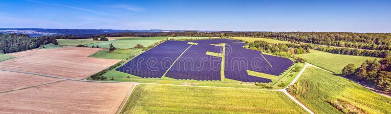 Panoramic Image of a Large Solar Field on a Green Meadow in Daylight ...
