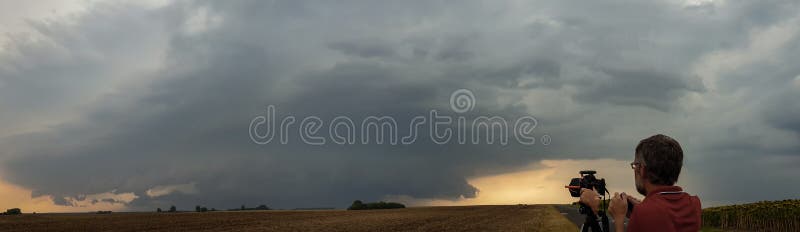 A Stormchaser is Photographing a Supercell Thunderstorm Editorial Stock ...