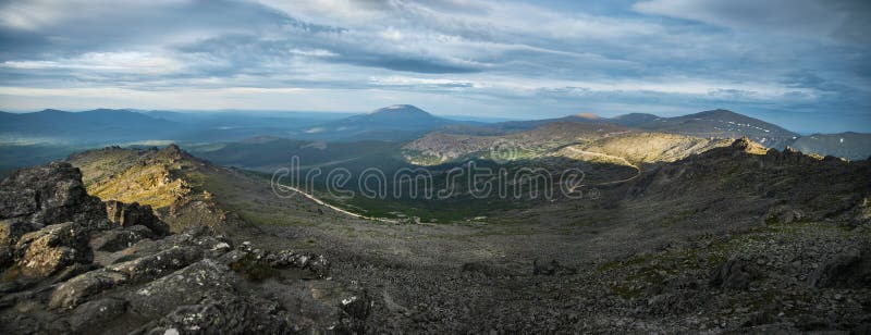 Panoramic Mountain Vista Bathed in Sunlight and Shadow, a Dynamic ...