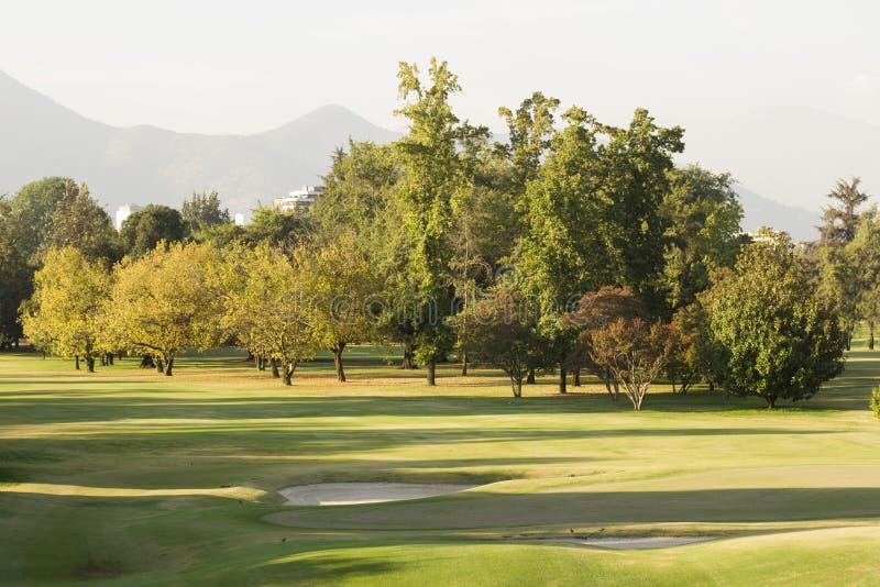 Golf Course with Trees and Mountains Behind Stock Image - Image of ...