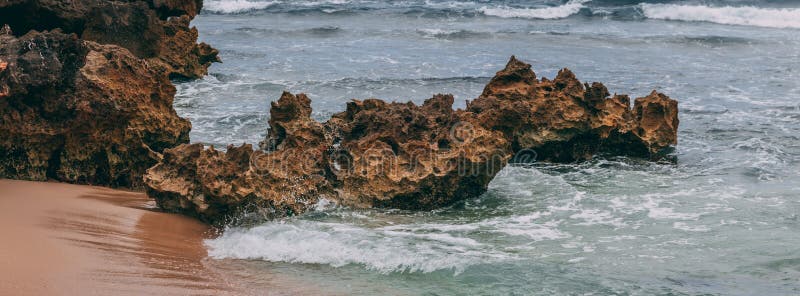 Panoramic Shot of Big Rocks at the Beach Stock Photo - Image of sand ...