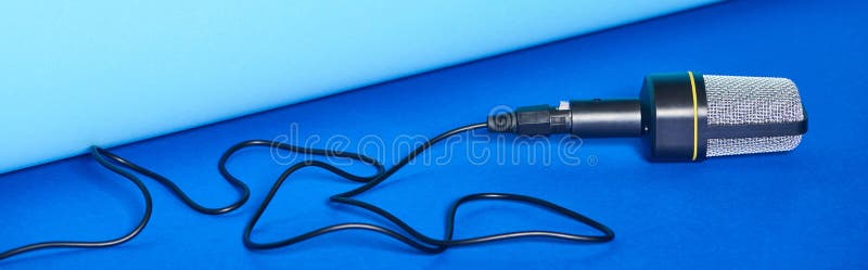 Panoramic Shot of Black Microphone with Wire on Colorful Background ...
