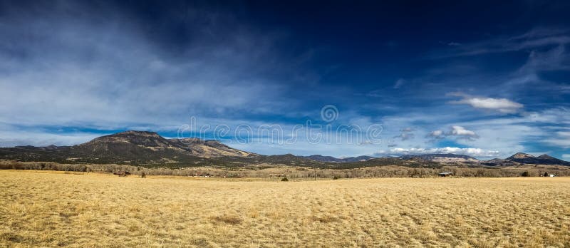 Flat Prairie Leading To Mountains Under a Blue Sky Stock Photo - Image ...