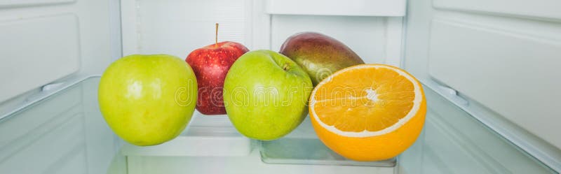 Panoramic Shot of Fresh Mango with Apples and Orange Slice on ...