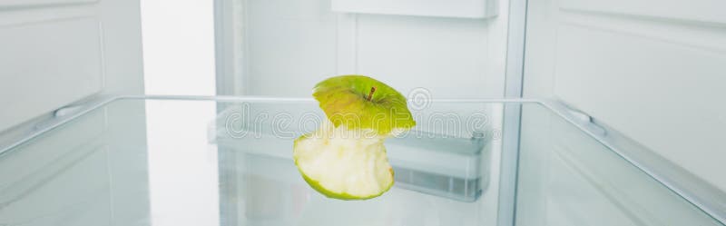 Panoramic Shot of Gnawed Green Apple in Refrigerator with Open Door on ...