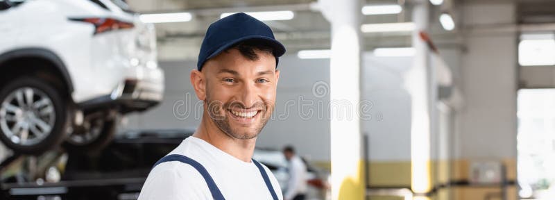 Panoramic Shot of Happy Mechanic in Stock Photo - Image of mechanic ...