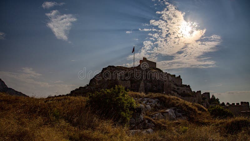 A Panoramic Shot of a Hill that Has Structures on it that Descend To ...
