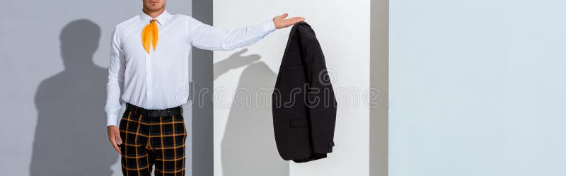 Shot of Man Holding Jacket on White and Grey Stock Image - Image of ...