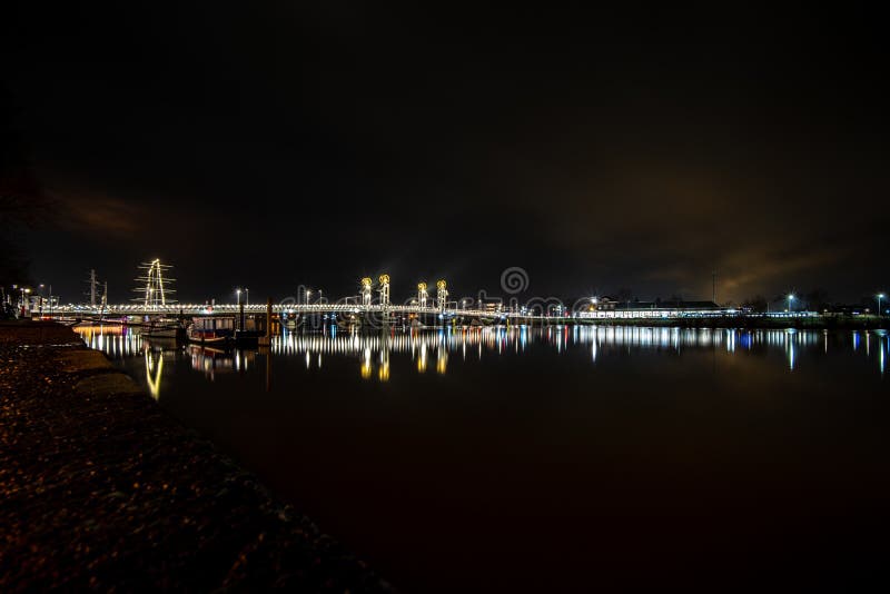 Panoramic Shot of a Night Skyline with Light Reflections on the Water ...