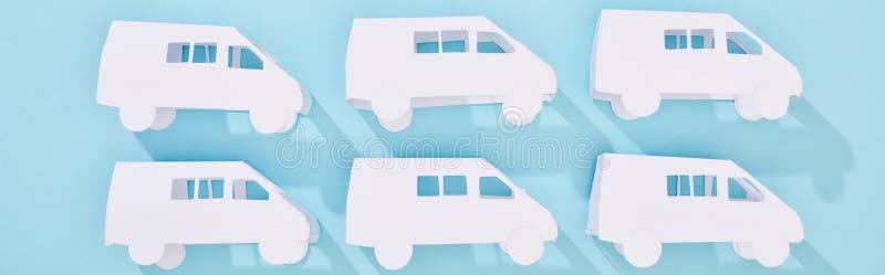 Panoramic Shot of White Mini Van Models on Blue Background. Stock Image ...
