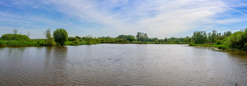 Panoramic View of a Belgian Nature Reserve with a Pond, Forests, and a ...