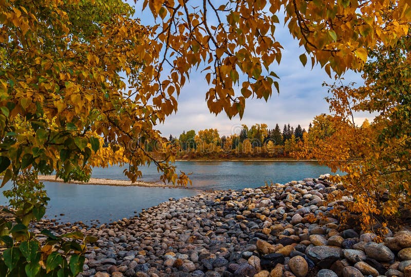 Cloudy Sky Over a Riverside Fall Park in Calgary Stock Photo - Image of ...