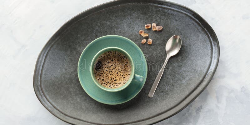 A Panoramic View of a Cup of Black Coffee, Shot from the Top on a Tray ...