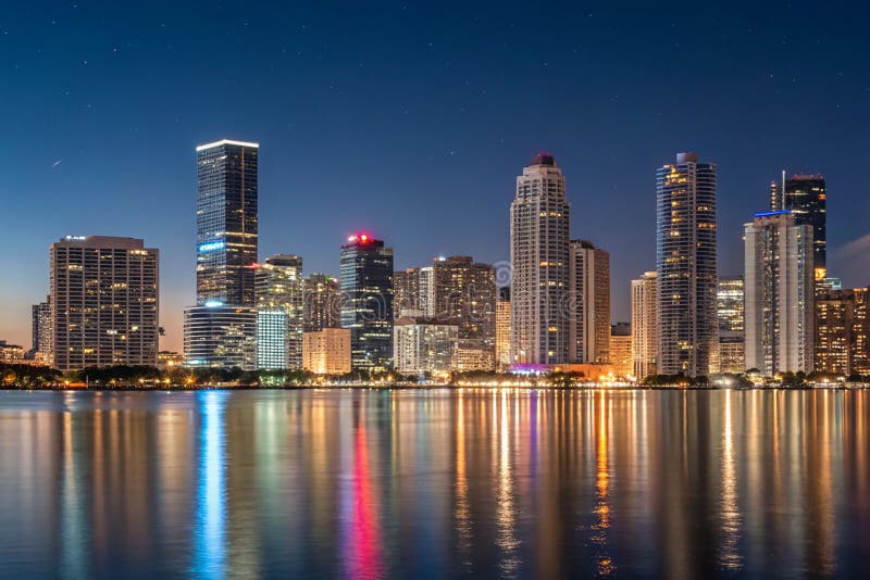 Panoramic View of the Downtown Miami Skyline at Night with Reflections ...