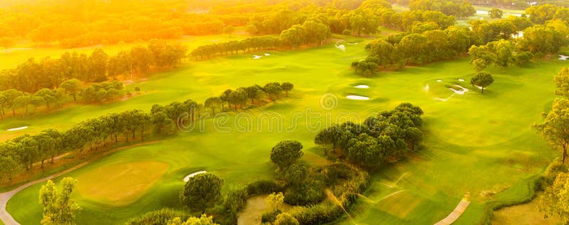 A Panoramic View of a Golf Course Bathed in Golden Sunset Light ...