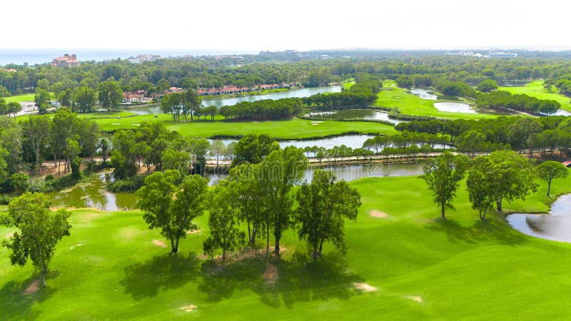 Panoramic View of a Golf Course with Water Features, Sand Traps, and ...