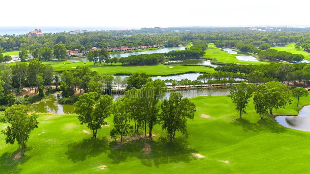 Panoramic View of a Golf Course with Water Features, Sand Traps, and ...