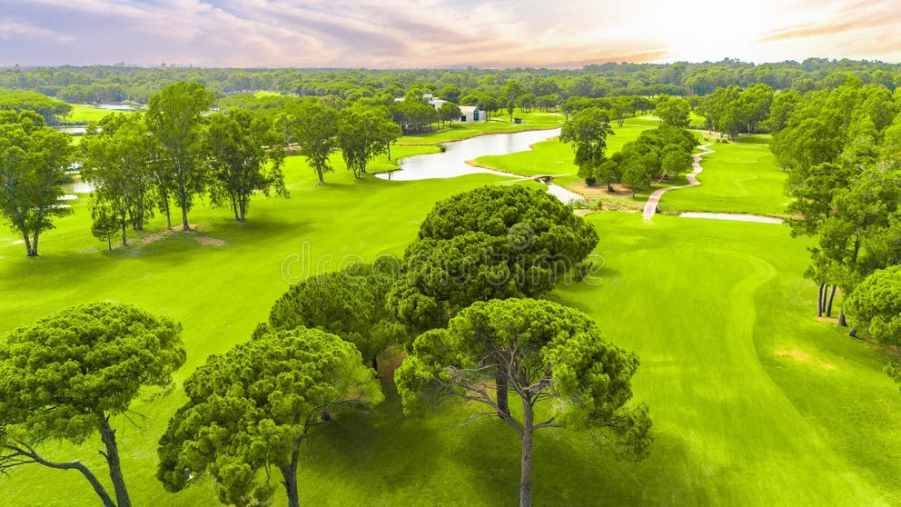 Panoramic View of a Golf Course with a Winding River, Lush Greenery ...